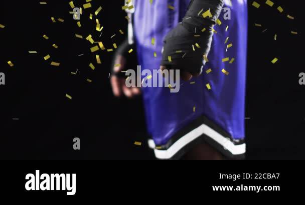 Animation of confetti falling over african american male boxer on black ...