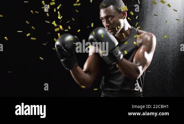 Animation of confetti falling over african american male boxer on black ...