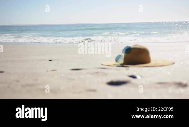 Animation of hello there summer holidays text over straw hat and ...