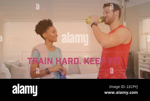 Animation of train hard keep fit text over diverse couple drinking ...