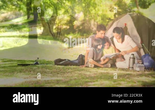 Family reading book together over animation of serene forest landscape ...