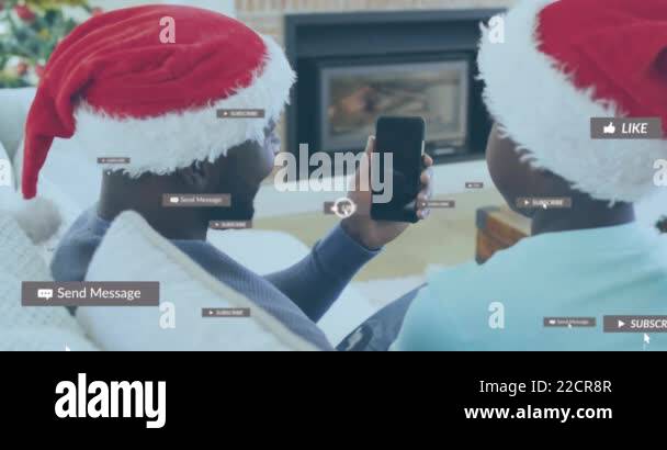 Social media notifications animation over people wearing Santa hats and ...