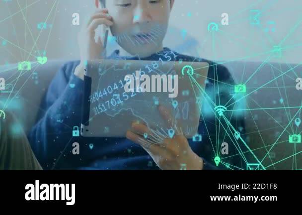 Talking on smartphone and using tablet, man surrounded by digital ...