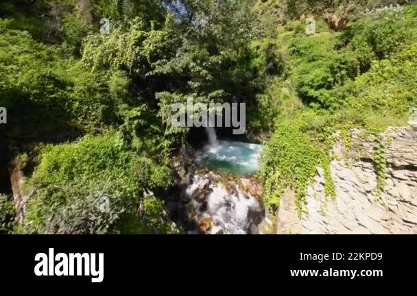 Discover the serene beauty of a fresh water spring with a small ...