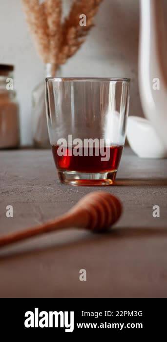 Pouring milk into black tea glass cup. Stop motion animation vertical ...