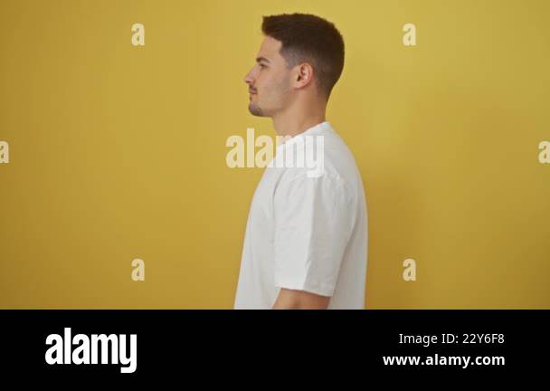 Handsome young hispanic man fashionably poses in white t-shirt ...