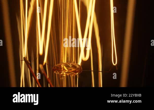Macro detailed incandescent Edison Tungsten filament lamp flickering ...