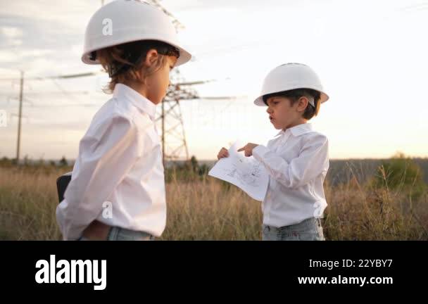 Preschool boys as engineer or manager with safety helmet. Job in ...
