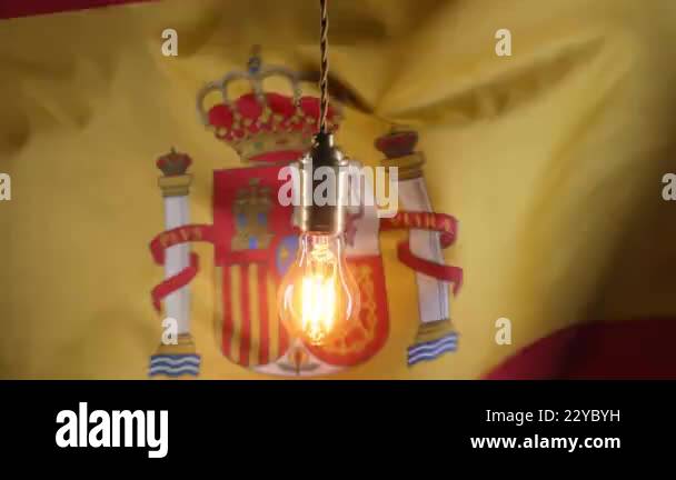Flashing Edison light bulb on spanish flag background. Bad electricity ...