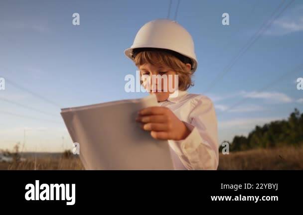 Preschool boy as engineer or manager with safety helmet. Job in ...