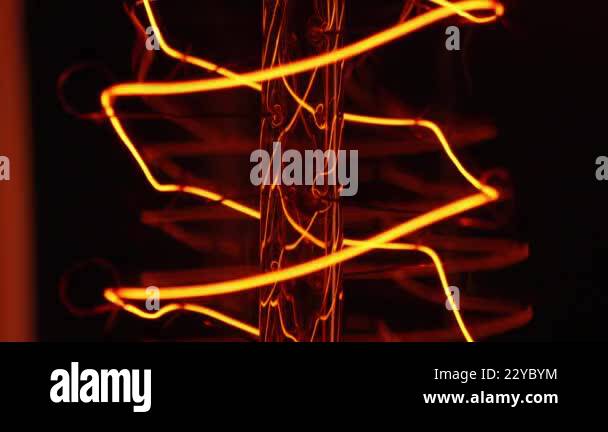 Macro detailed incandescent Edison Tungsten filament lamp flickering ...