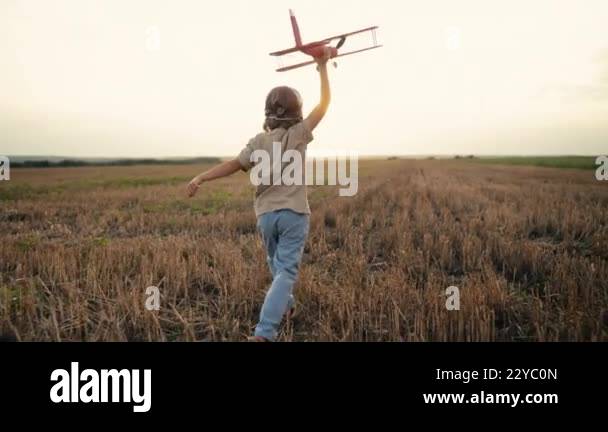 Unrecognizable 5 years old child boy running with wooden vintage ...