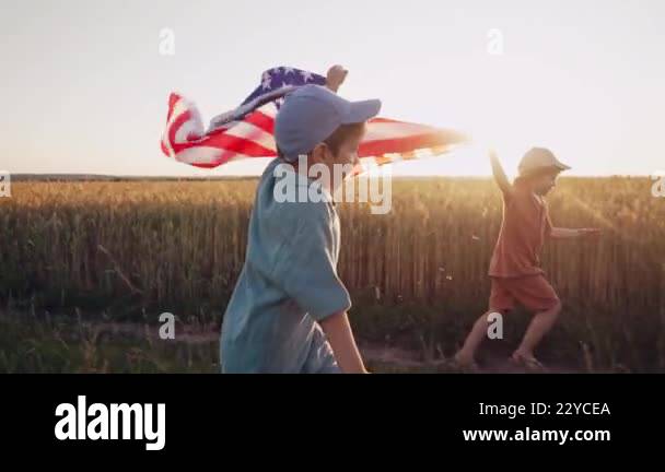 Cute little boys - American patriot kids running with national flag on ...