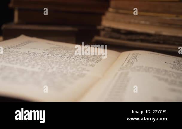 Opened saved old paper book with ancient writings. Religious literature ...