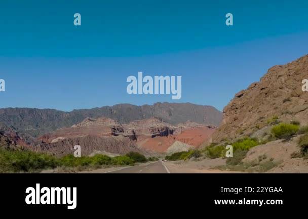 Route on the way to Purmamarca, surrounded by colourful landscape ...