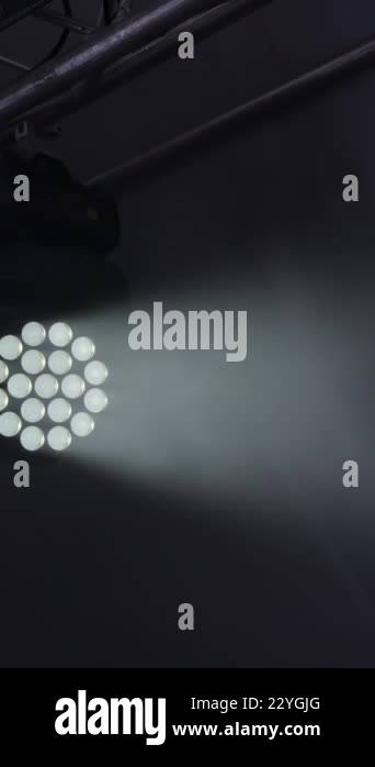 A focused spotlight effectively casts light on the stage, skillfully ...