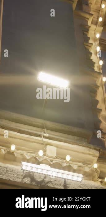 A beautiful night view of a grand buildings illuminated facade ...