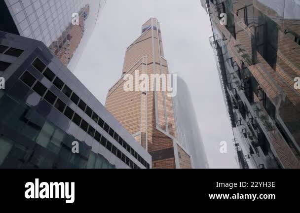 A towering skyscraper prominently viewed from the ground level ...