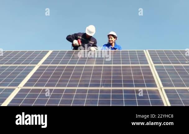 Happy high fives of electrical engineers, smart men and women work as a ...