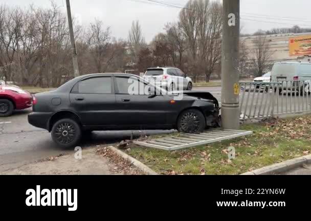 Broken bumper and hood of a car as a result of a collision with a pole ...