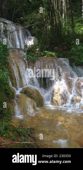 Video footage of a still portrait of an unspoiled waterfall with a ...