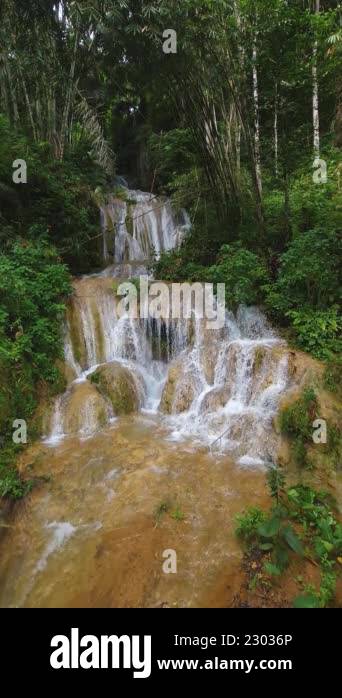 Video footage of a still portrait of an unspoiled waterfall with a ...