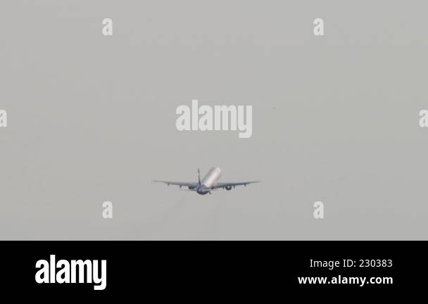 Commercial airplane climb after takeoff, long shot rear view. Footage ...