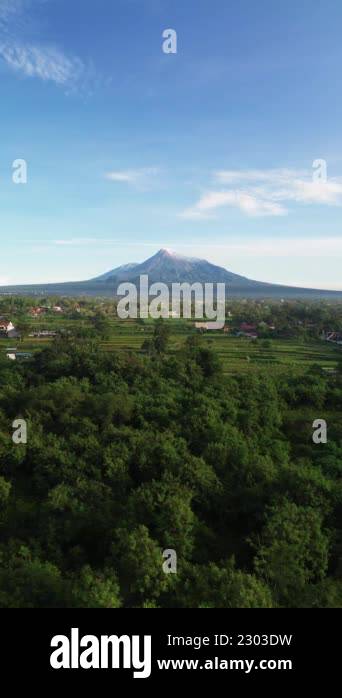 Aerial portrait footage of the beautiful panorama of Mount Merapi on a ...