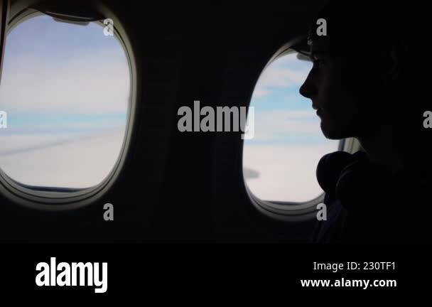 Teenager Enjoying Flight, Looking out Aircraft Window During Travel ...