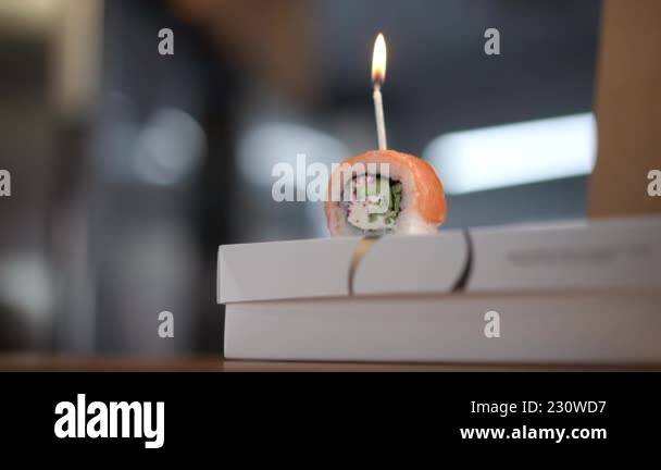 A wonderfully creative sushi roll designed with a candle, making it ...
