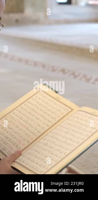 Image of little boy reciting verses from the Quran he is holding, verse ...