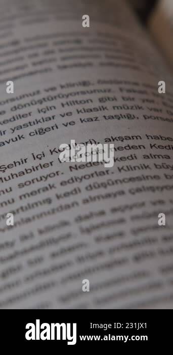 Old-fashioned reading habit of putting the phone on top of the book ...