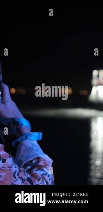 Women Take Picture, lights of the big ferry on the lake, the sea ...
