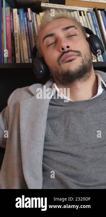 Concept image of young men having fun relaxing by listening to music at ...