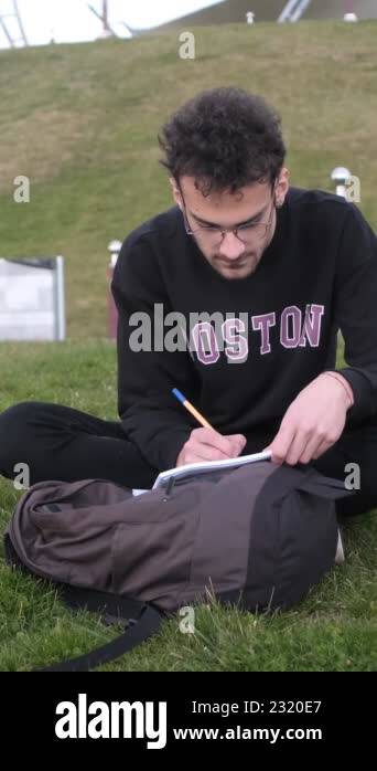 Writing activity on paper on the grass, working environment outside on ...