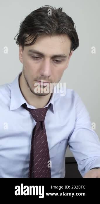Young shirt man working on computer, workplace of white collar working ...