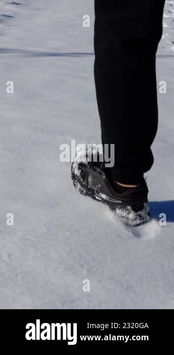 The traces left by the young man walking slowly on the snow, image ...