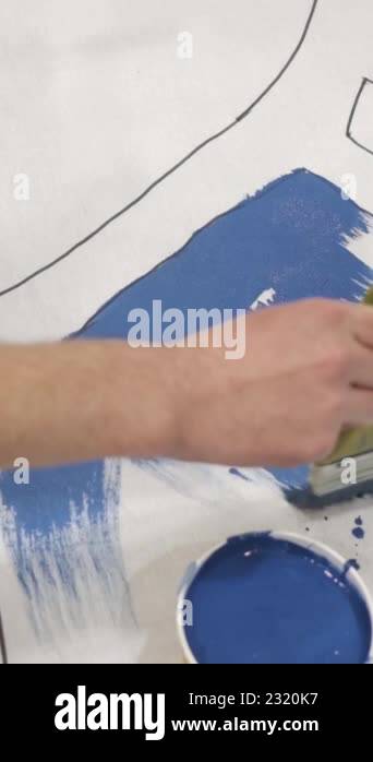 Artist painting blue color with slow motion brush movements, artist ...