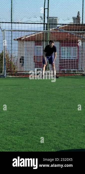 One of the young people playing ball on the carpet shoots the ...