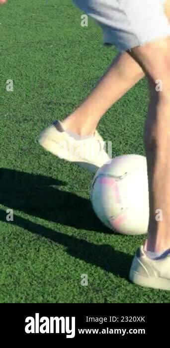 Close-up of mans feet playing with soccer ball on carpet, young male ...