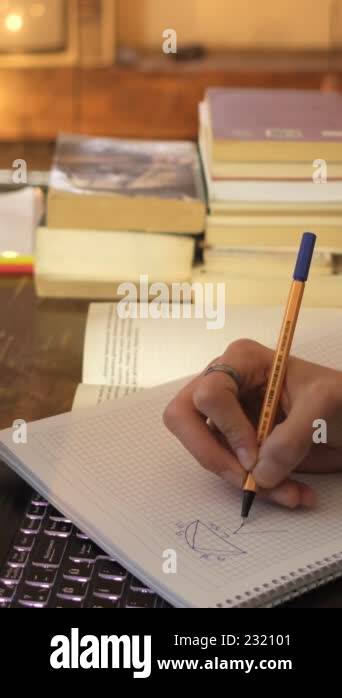 Young male working looking at his notes on the computer screen, student ...