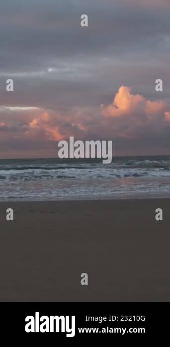 A young man pace through the cloud and coastline scenery, view towards ...