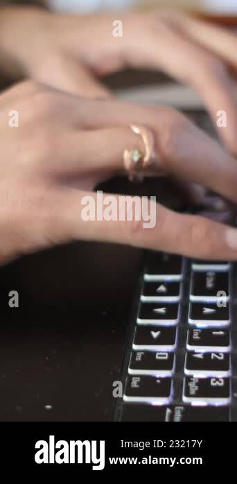 Image of hands hovering over keyboard, typing on computer letters ...