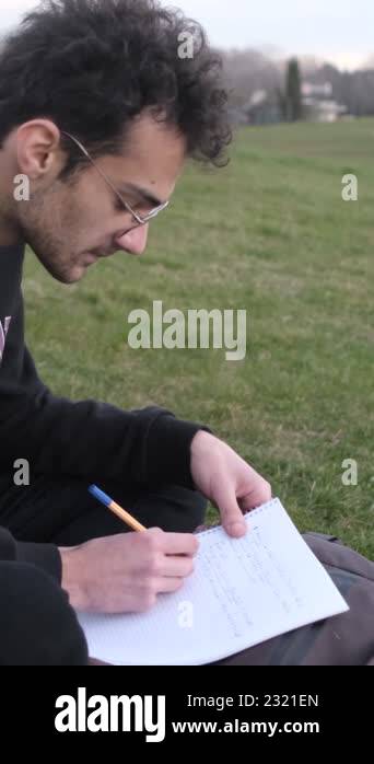 Writing activity on paper on the grass, working environment outside on ...