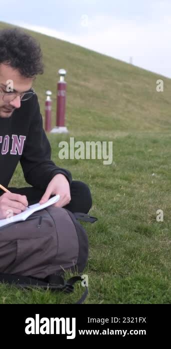 Writing activity on paper on the grass, working environment outside on ...