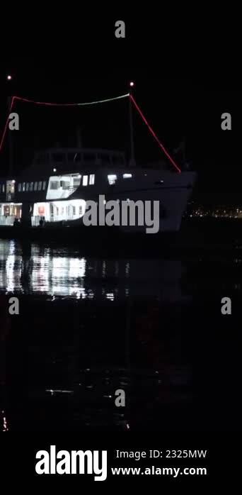 Ferry In Bay On Night, lights of the big ferry on the lake, the sea ...