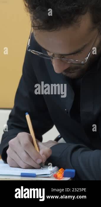 Student Write Paper, student studying in class, taking an exam, writing ...