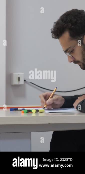 Man Homework Table, studying in class, student sitting at desk and ...