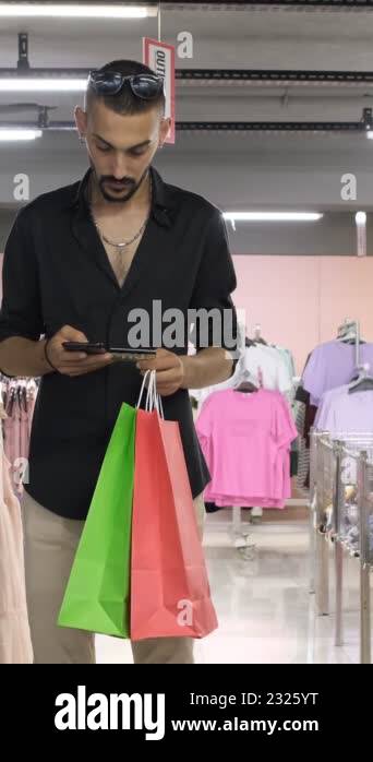 Man online shopping in store, shopping from the phone screen in the ...