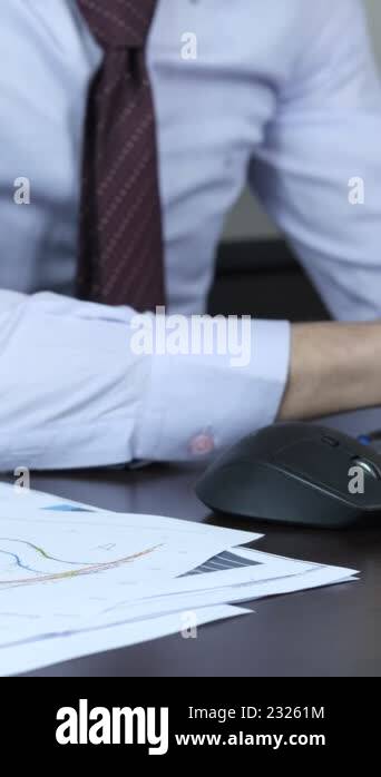 Employee running his business from computer, desk work environment in ...